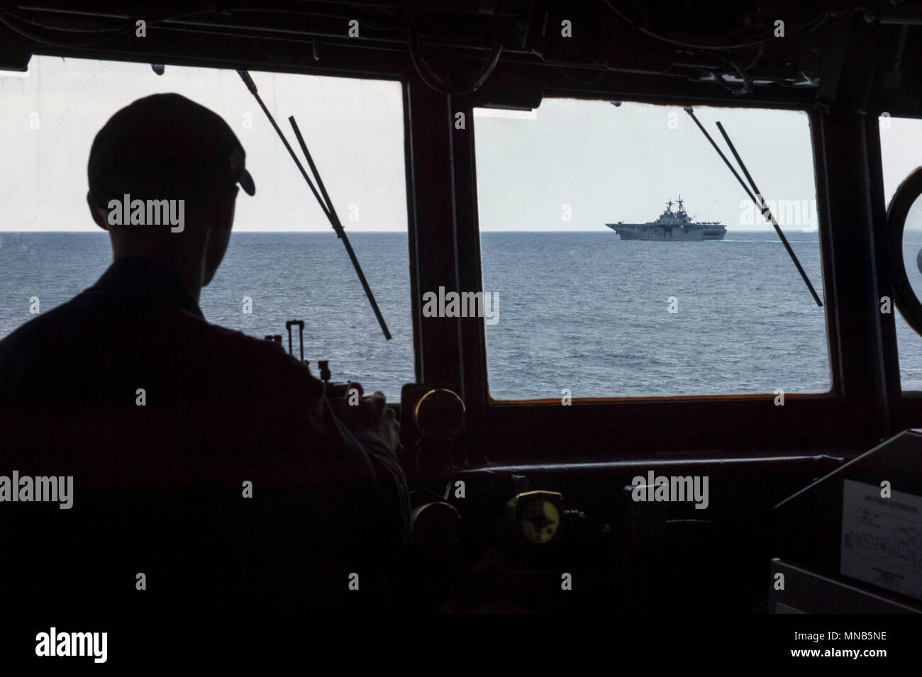 WATERS SOUTH OF JAPAN (March 12, 2018) Ensign Anders Holt, from Bedford ...
