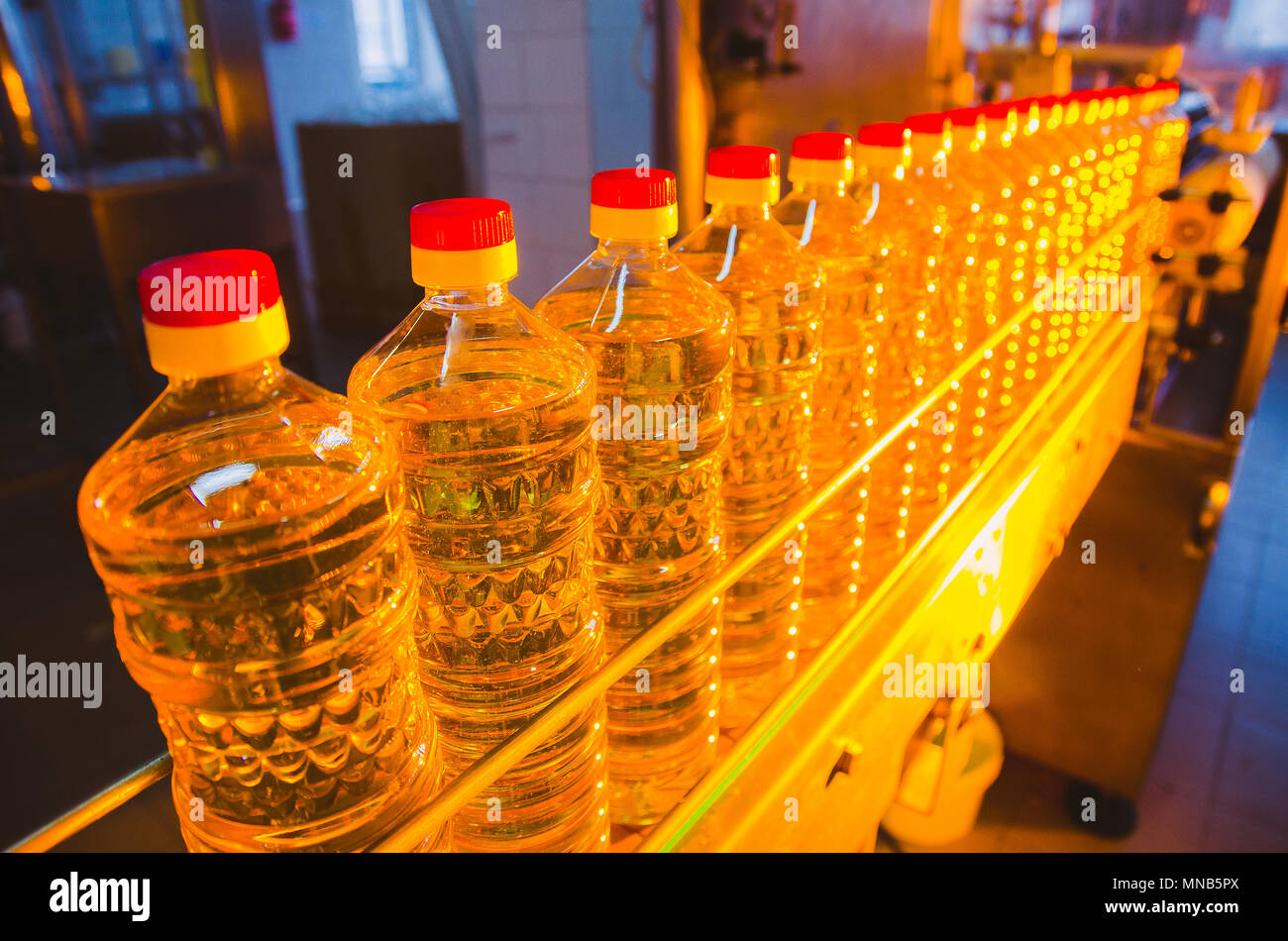 Sunflower oil. Factory line of production and filling of refined oil ...