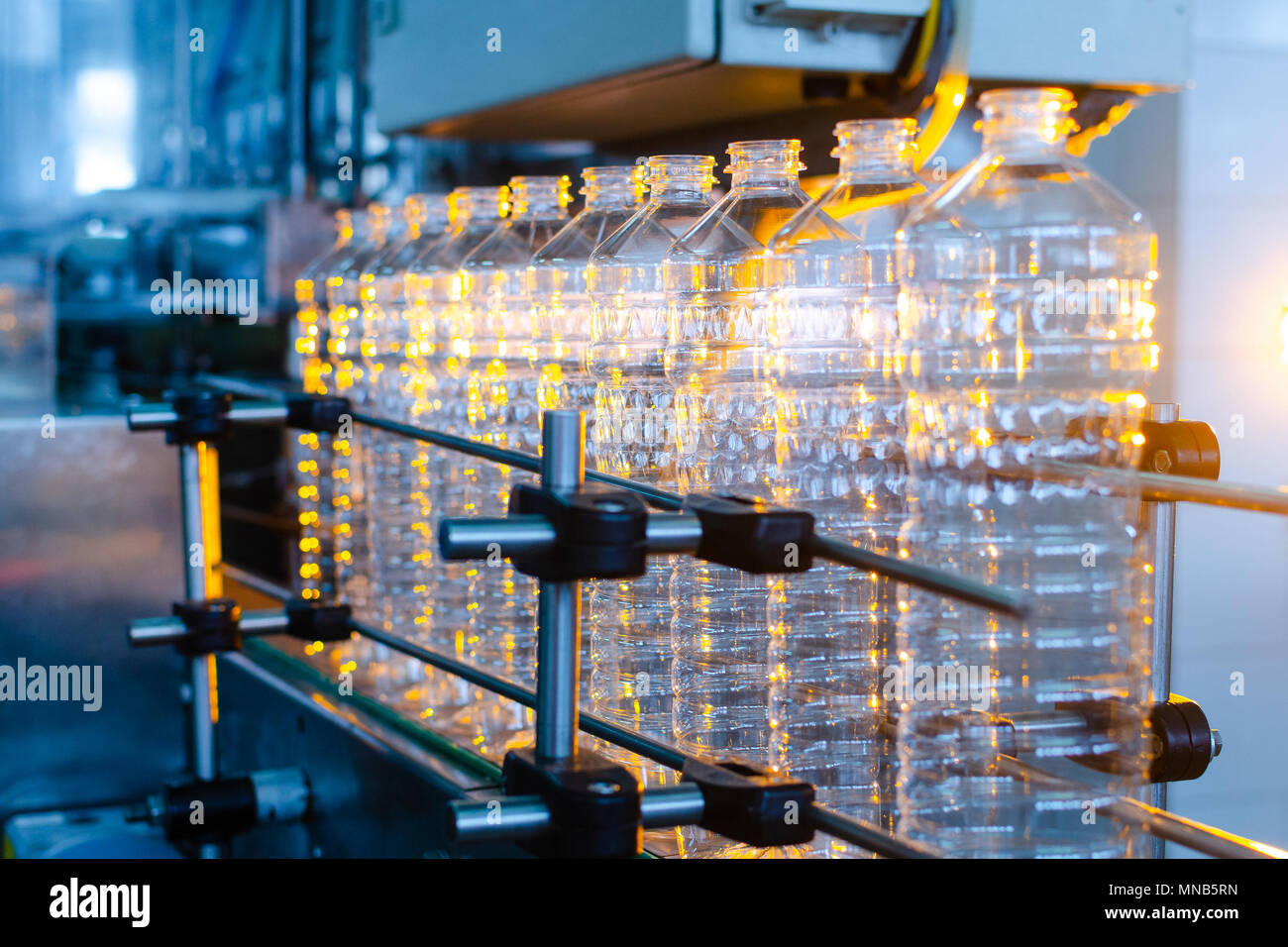 Bottle. Industrial production of plastic pet bottles. Factory line for ...