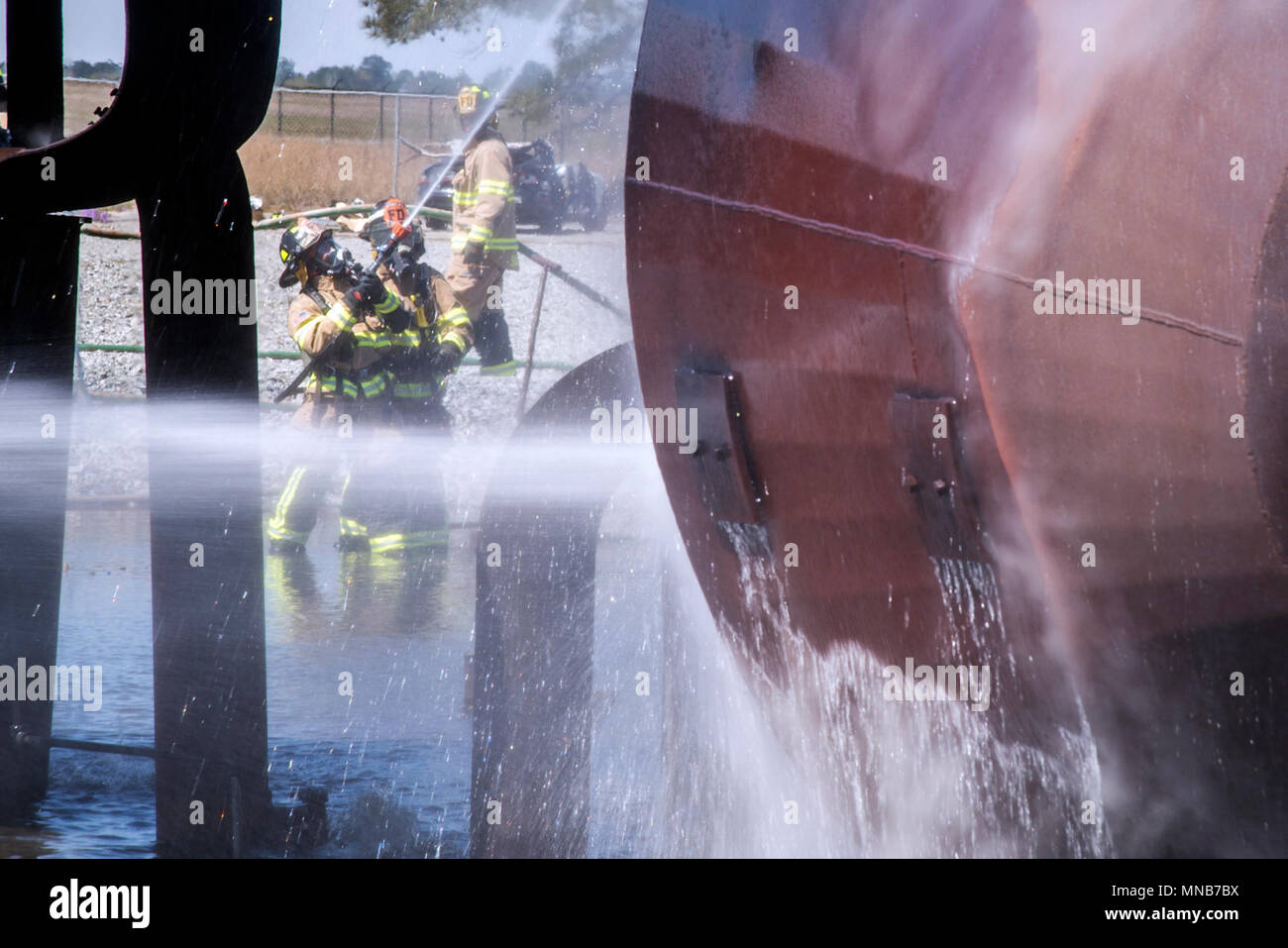 Firefighters from the 23d Civil Engineer Squadron (CES), extinguish a ...