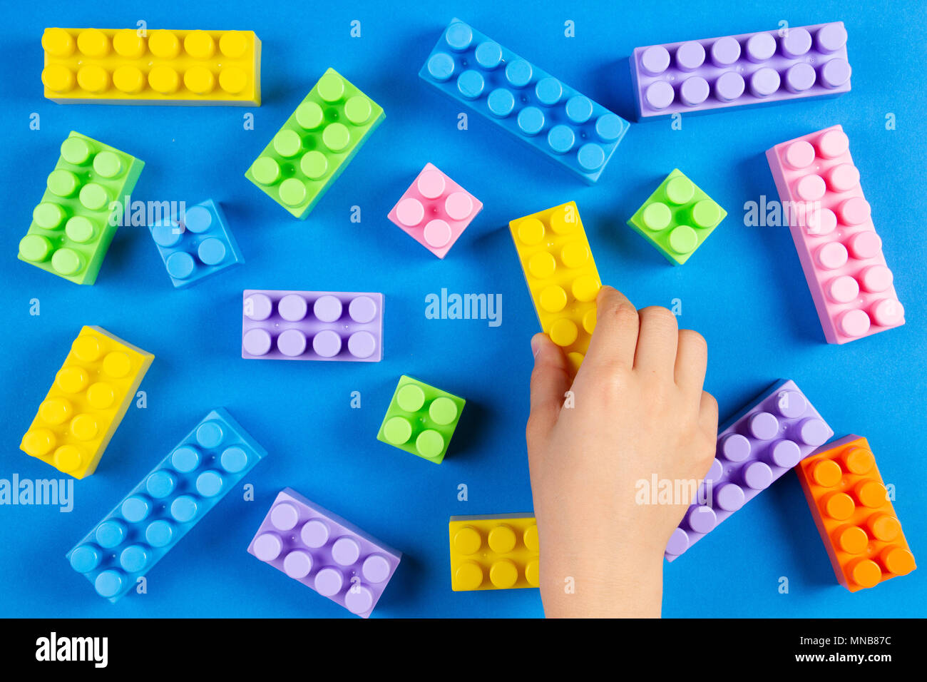 Child boy playing colored blocks hi-res stock photography and images ...