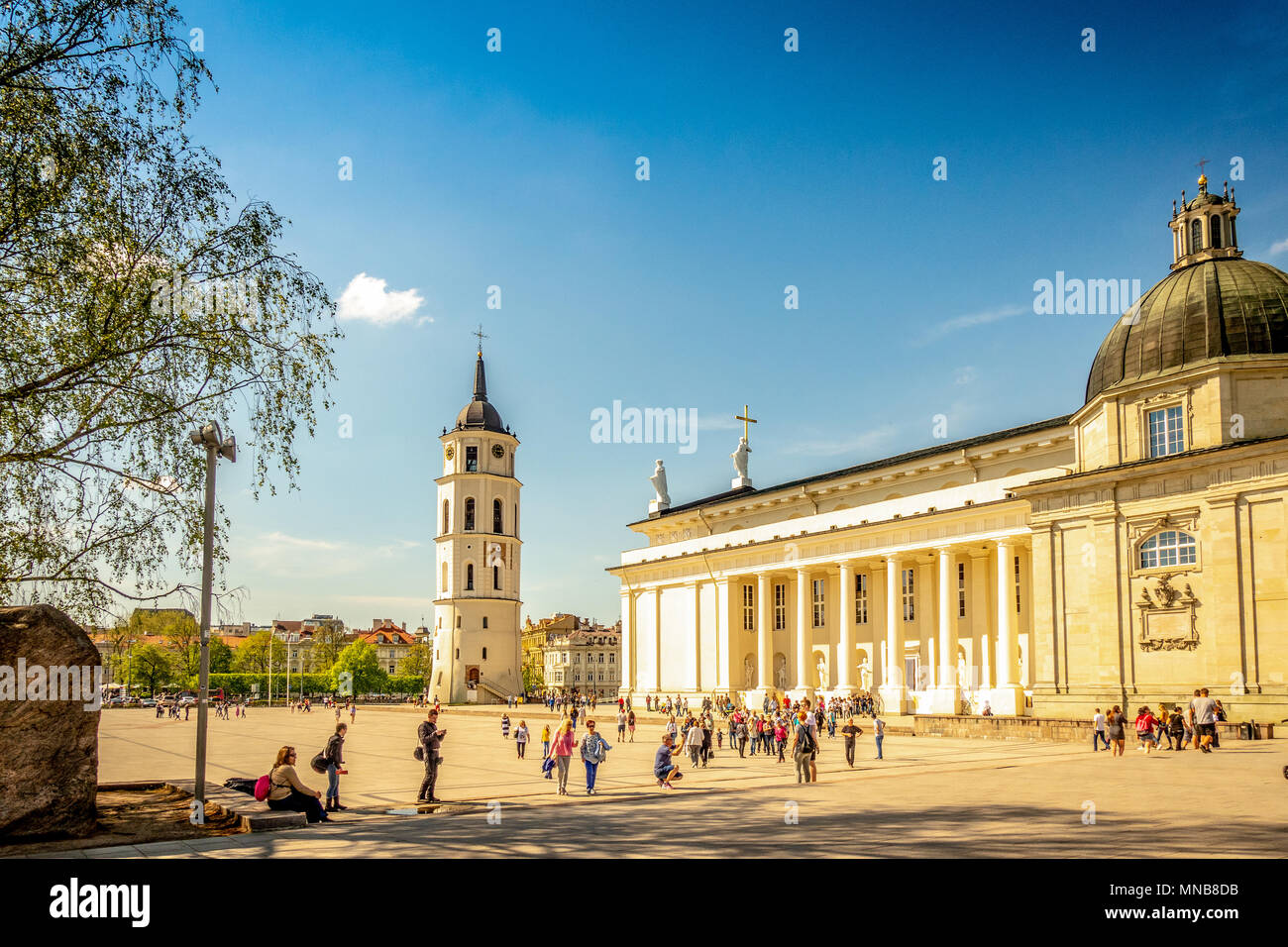 View to Vilnius Cathedral, bell tower and Cathedral square with people ...