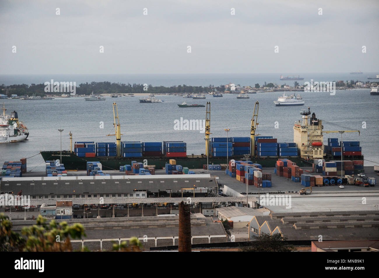 ANGOLA Luanda , harbour with freight ships and docks, behind Ilha do ...