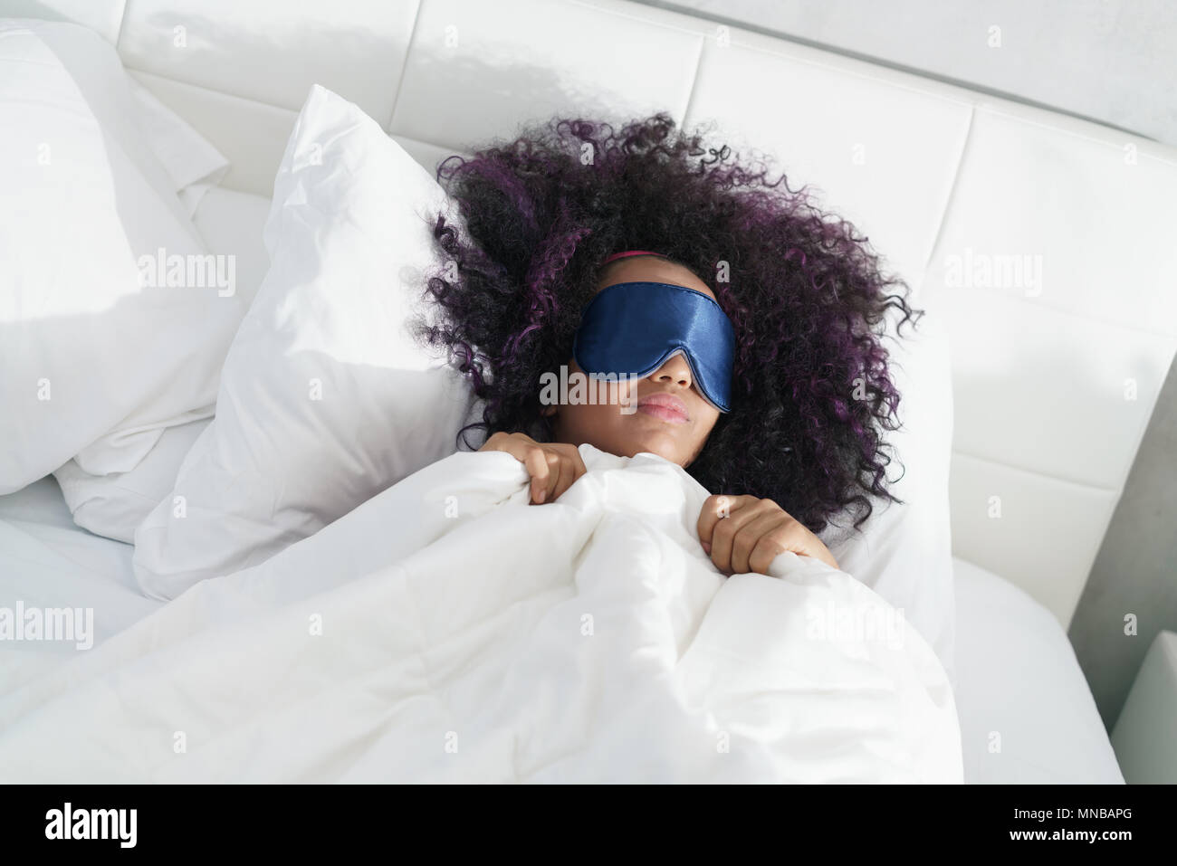 African american woman waking up in bed hi-res stock photography and ...