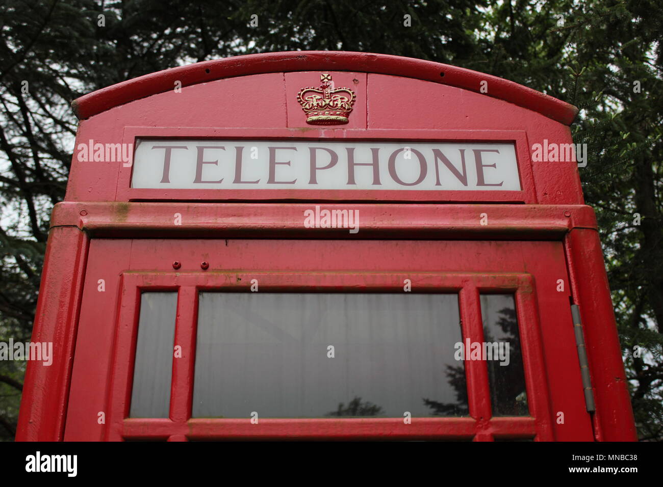Authentic English telephone booth placed on an upscale residential ...