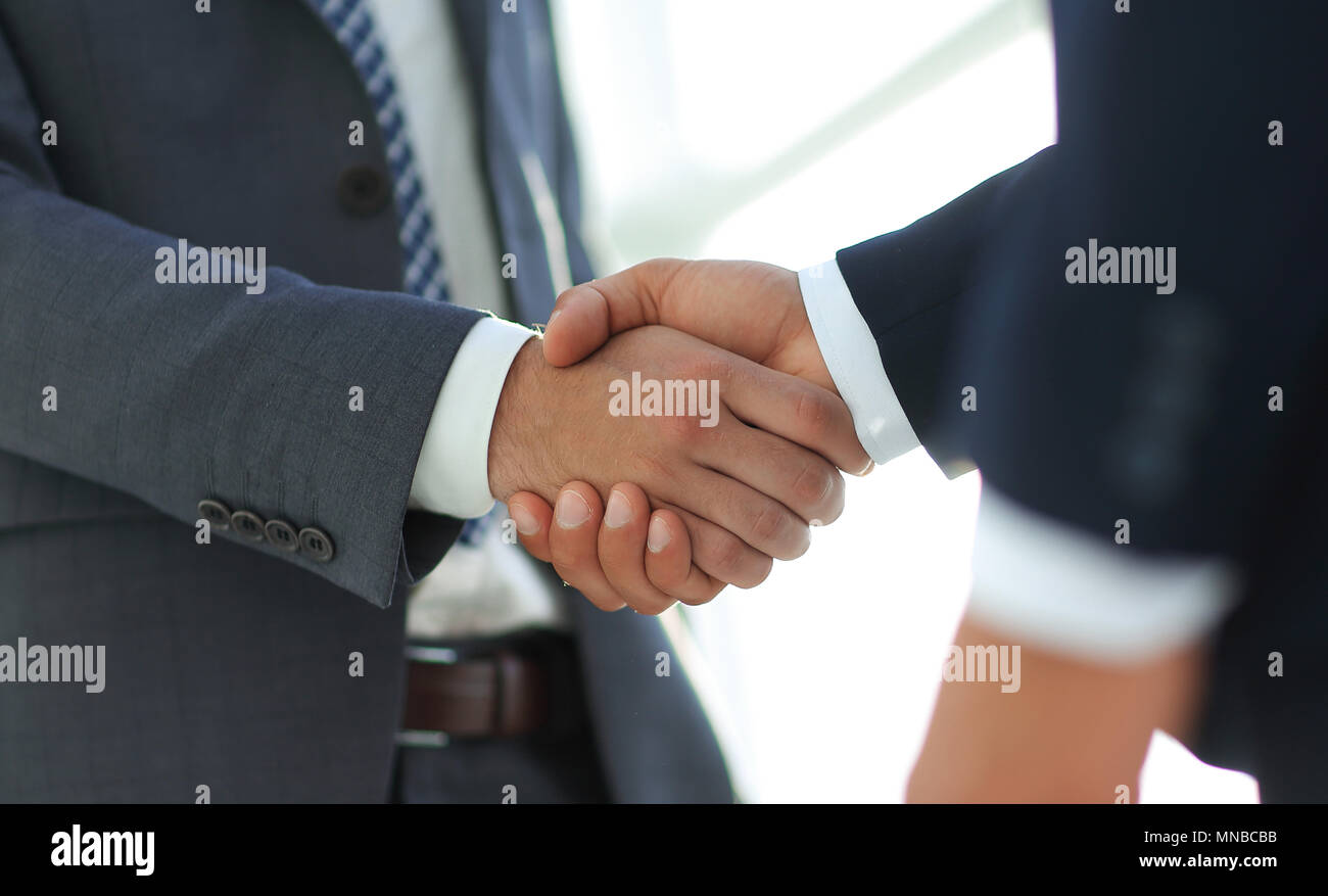 Businessman giving his hand for handshake to partner Stock Photo - Alamy