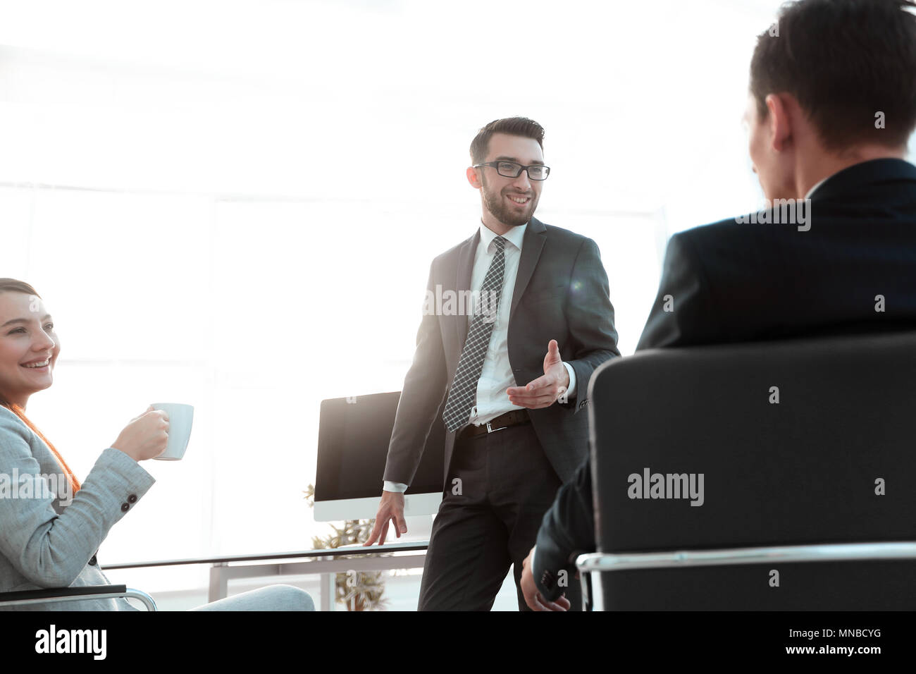 members of the business team talking in the office Stock Photo - Alamy