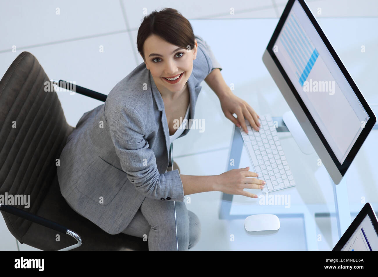 staff of the planning Department sitting behind a Desk and looking at ...