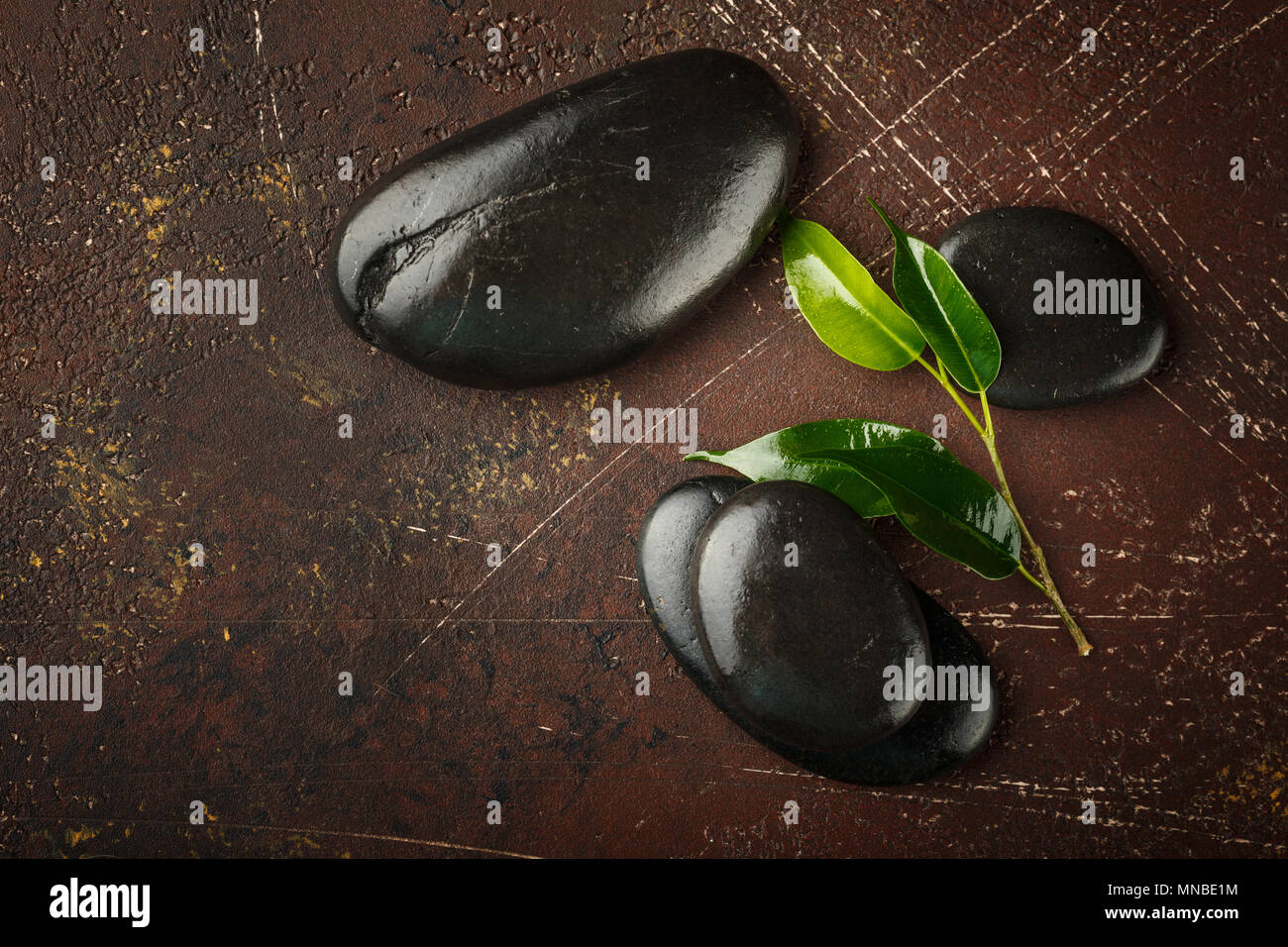 Pile of shiny zen pebble stones with bamboo plant, isolated on white ...