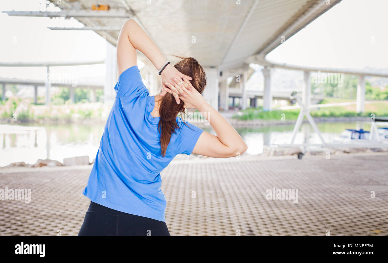 Fitness Woman doing workout outdoor, stretching exercise Stock Photo ...