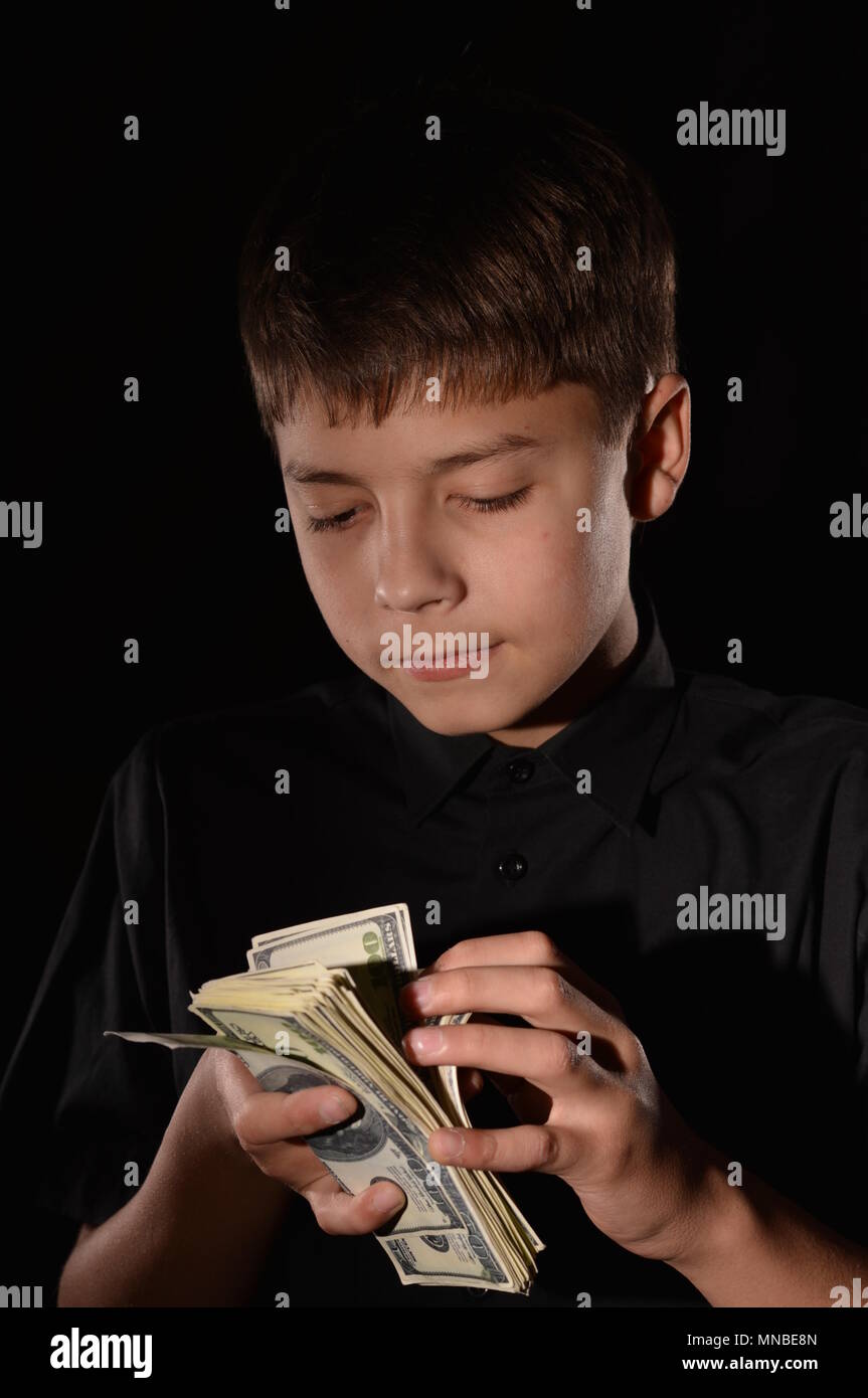 cute smiling boy with money Stock Photo - Alamy