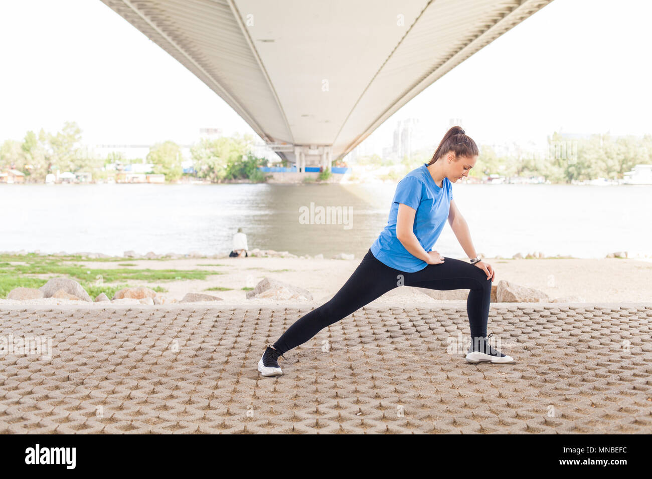Young Fitness Woman doing workout outdoor, stretching exercise Stock ...