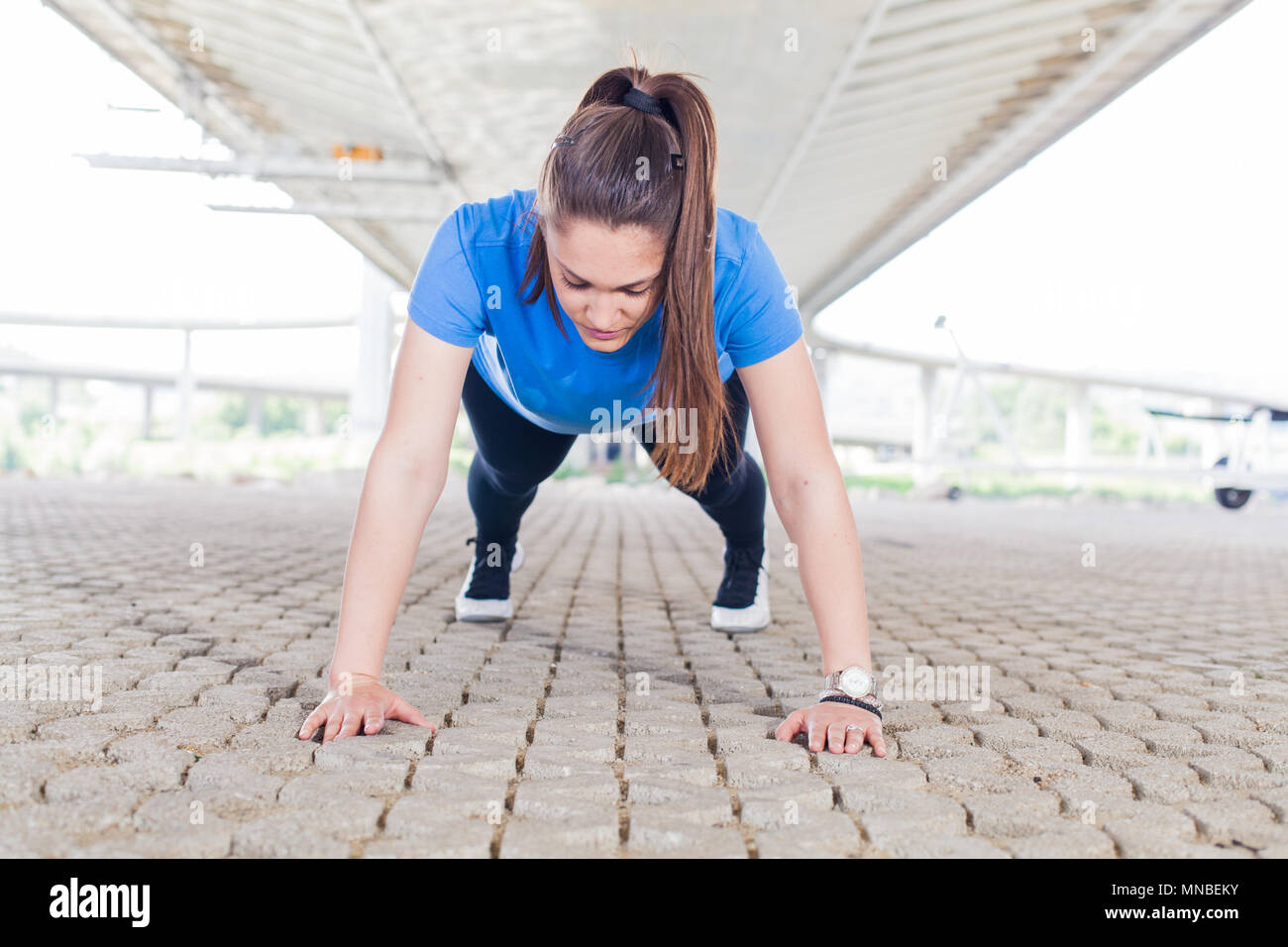 Young Fitness Woman doing workout outdoor, stretching exercise Stock ...