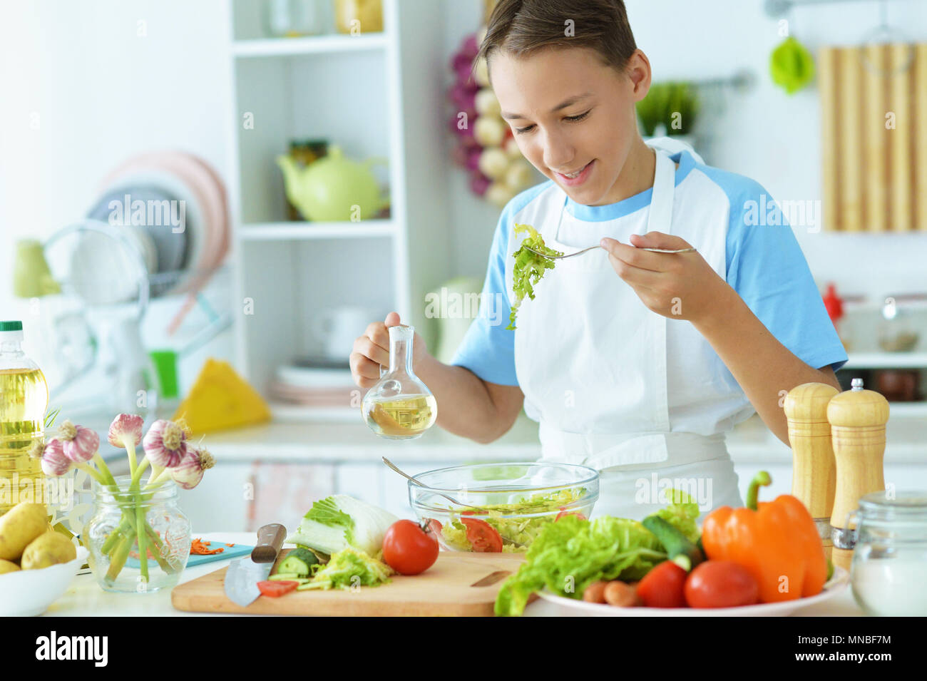 young guy in the kitchen Stock Photo - Alamy