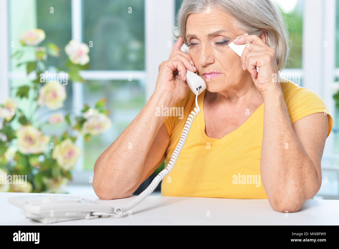 Portrait of upset senior woman Stock Photo - Alamy