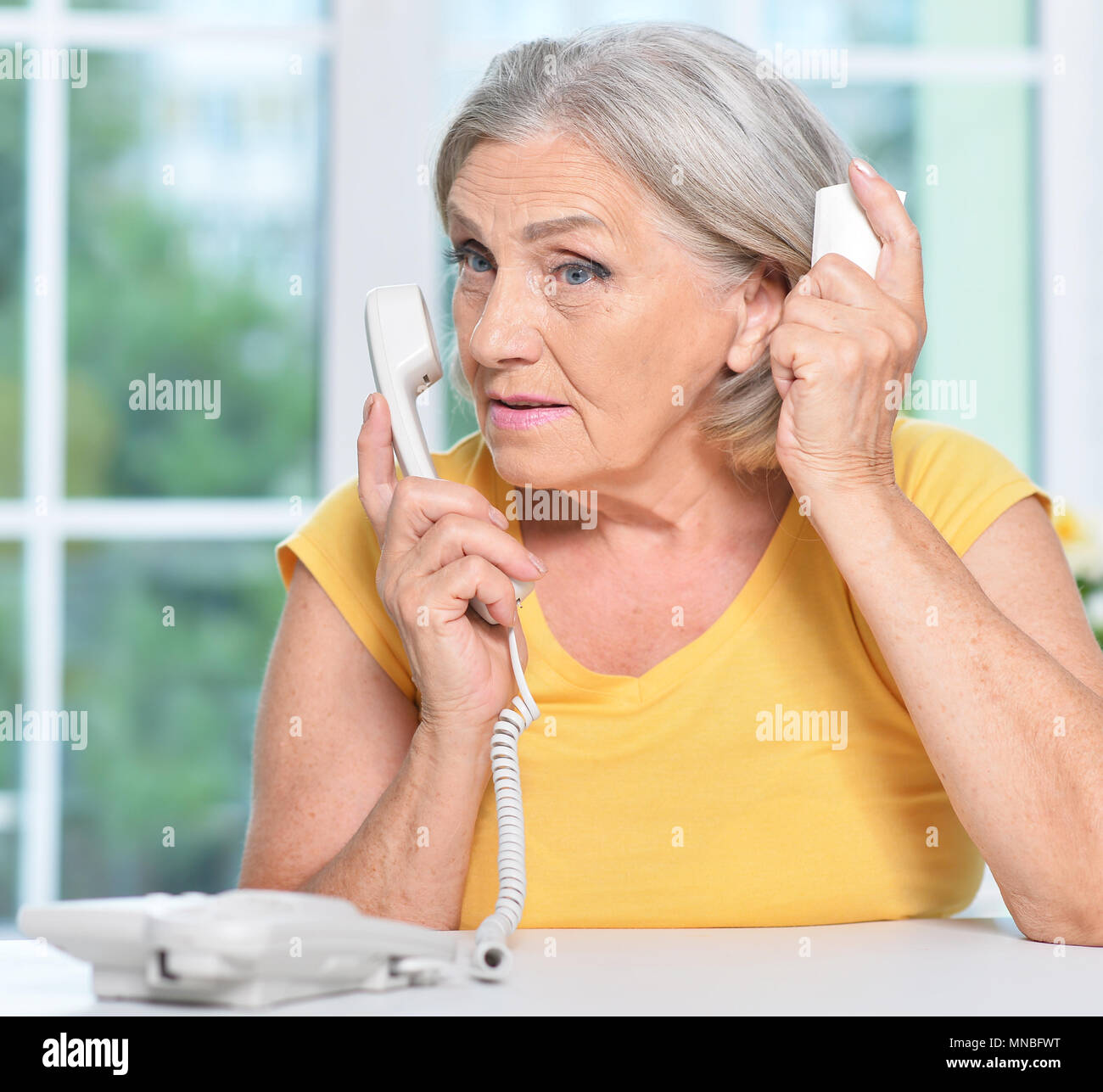 Portrait of upset senior woman Stock Photo - Alamy