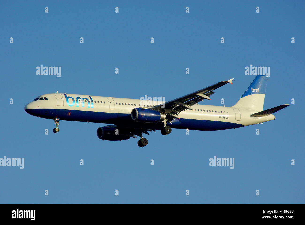 BMI British Midland Airbus A321 jet plane airliner coming in to land at ...