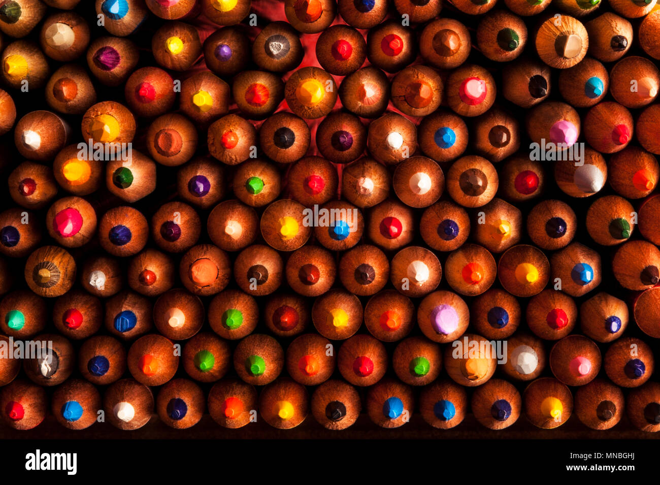 Close-up of multicolored pencils with design elements in rows stacked ...