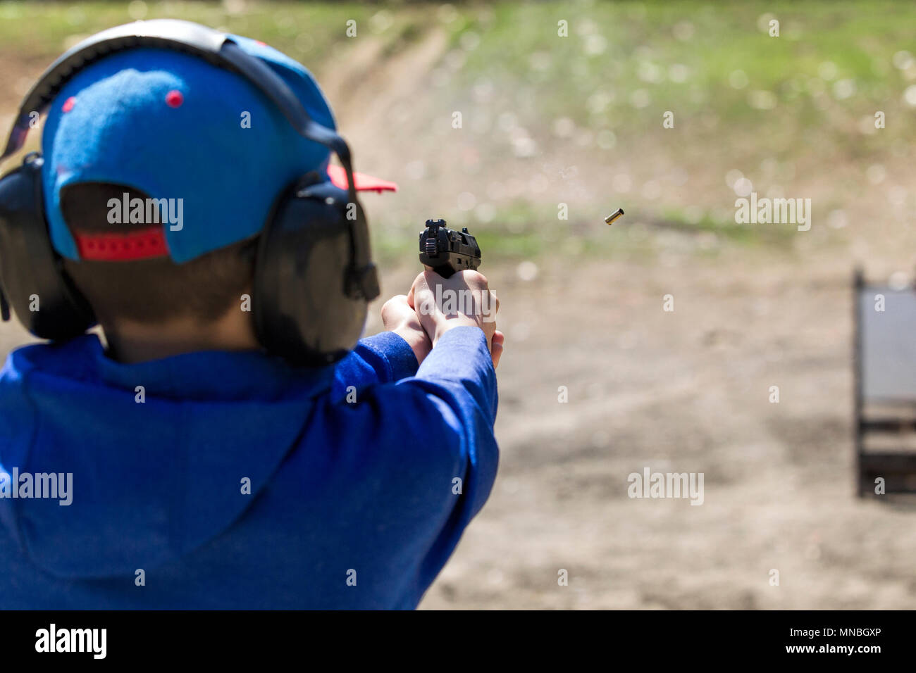 Boy learning to shoot hi-res stock photography and images - Alamy