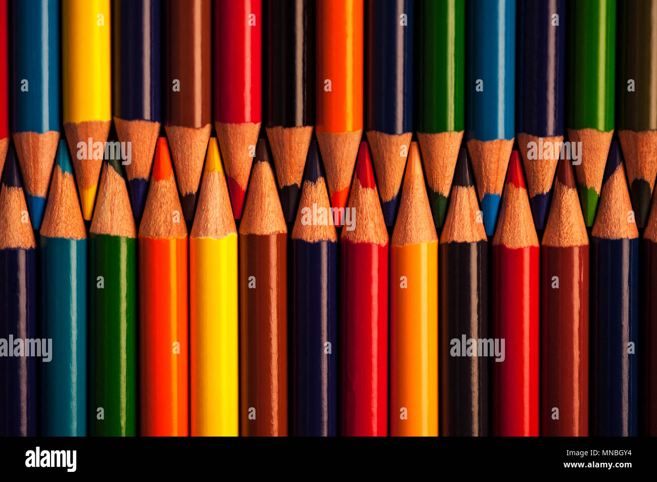 Multicolored pencils in rows creating a rainbow of colors Stock Photo ...