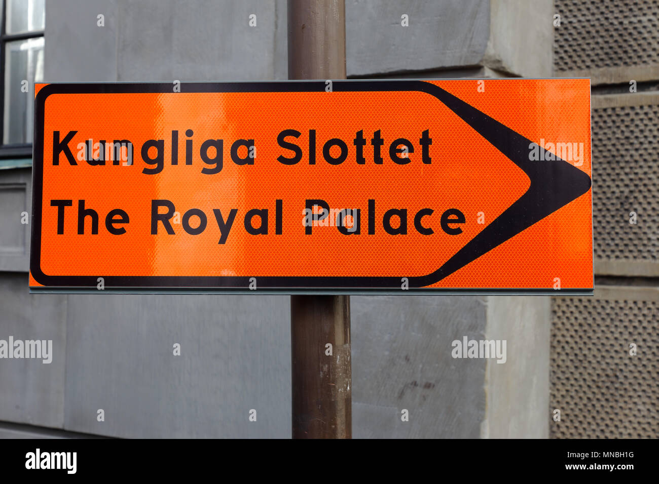 Orange signpost at the Stockholm royal palace Stock Photo - Alamy