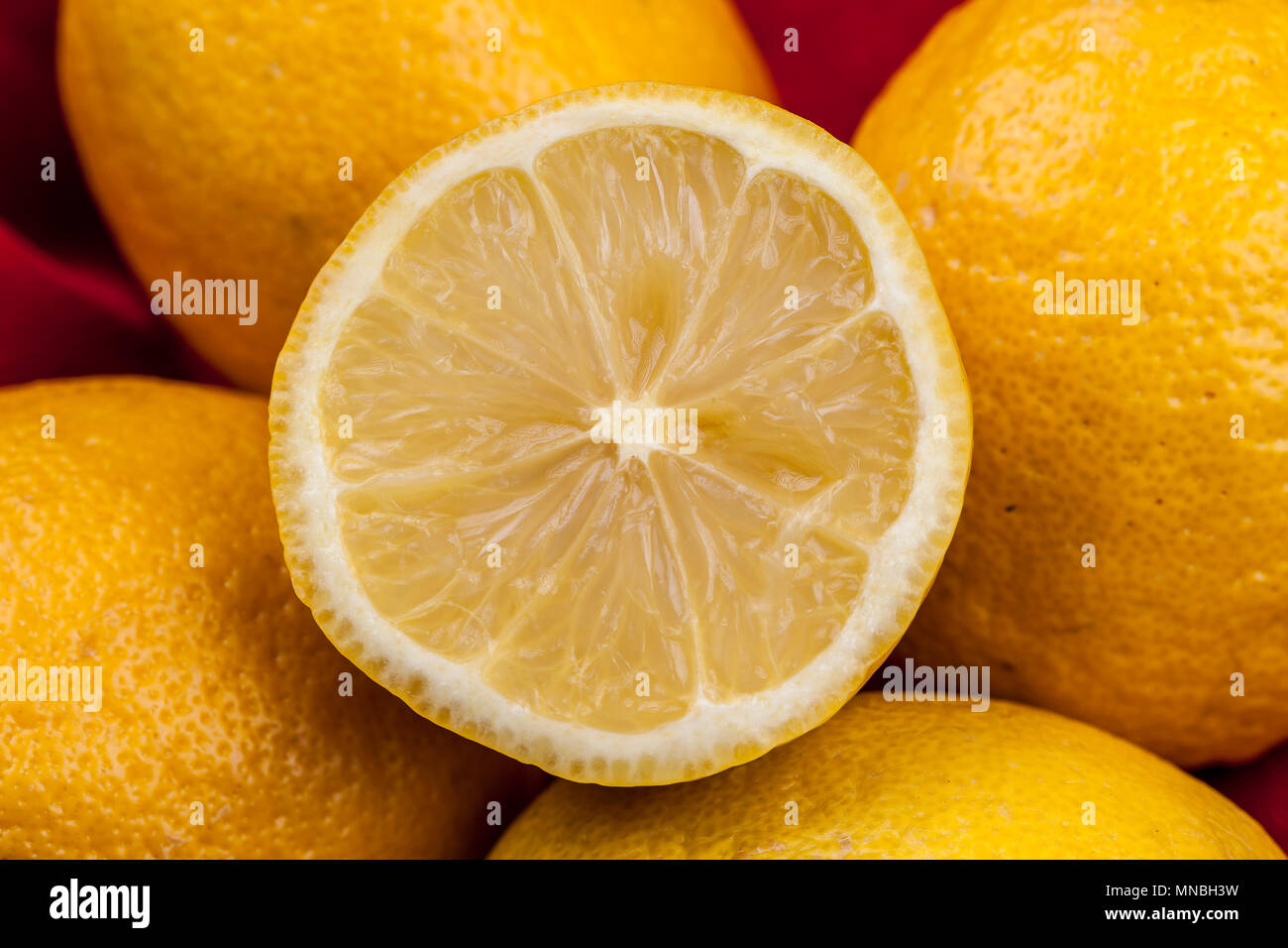 A close up of a cross section of a lemon in a basket Stock Photo - Alamy