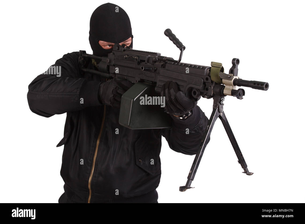 robber in black uniform and mask with machine gun Stock Photo - Alamy