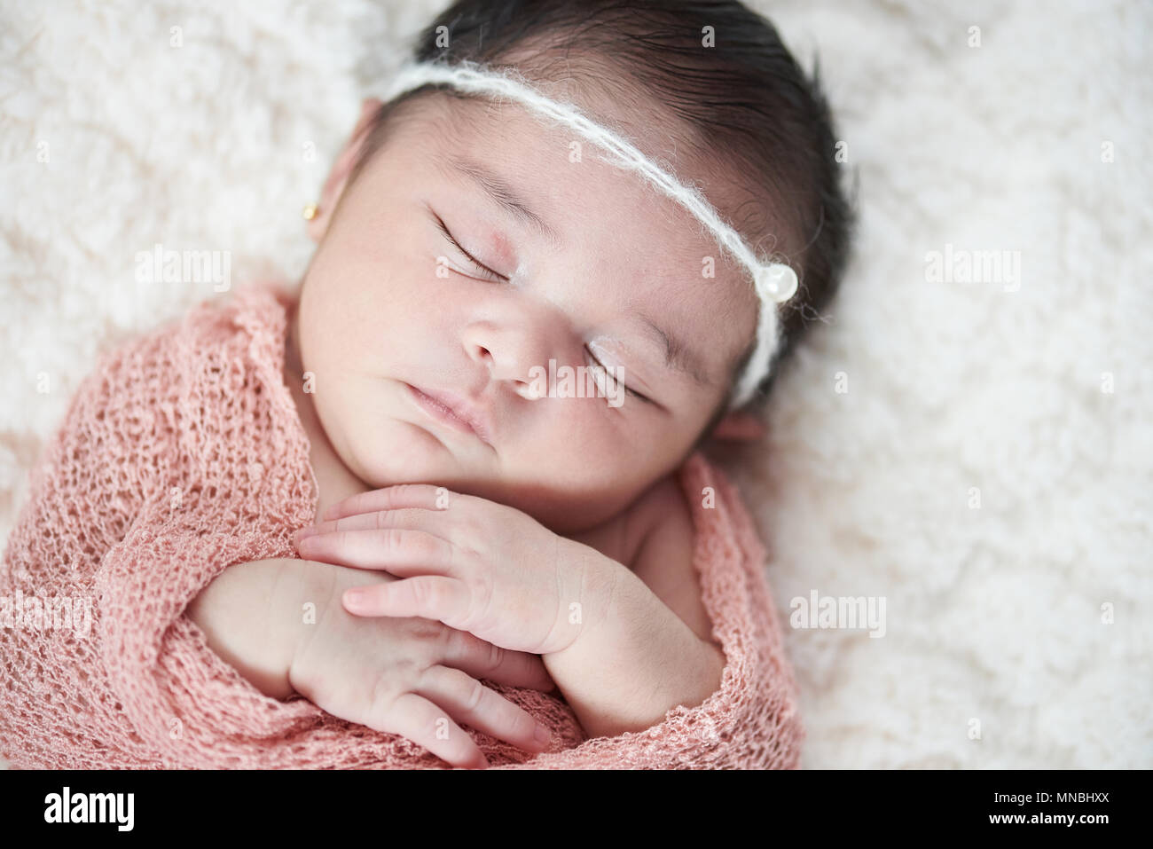 Latina newborn baby girl sleep close-up portrait Stock Photo - Alamy
