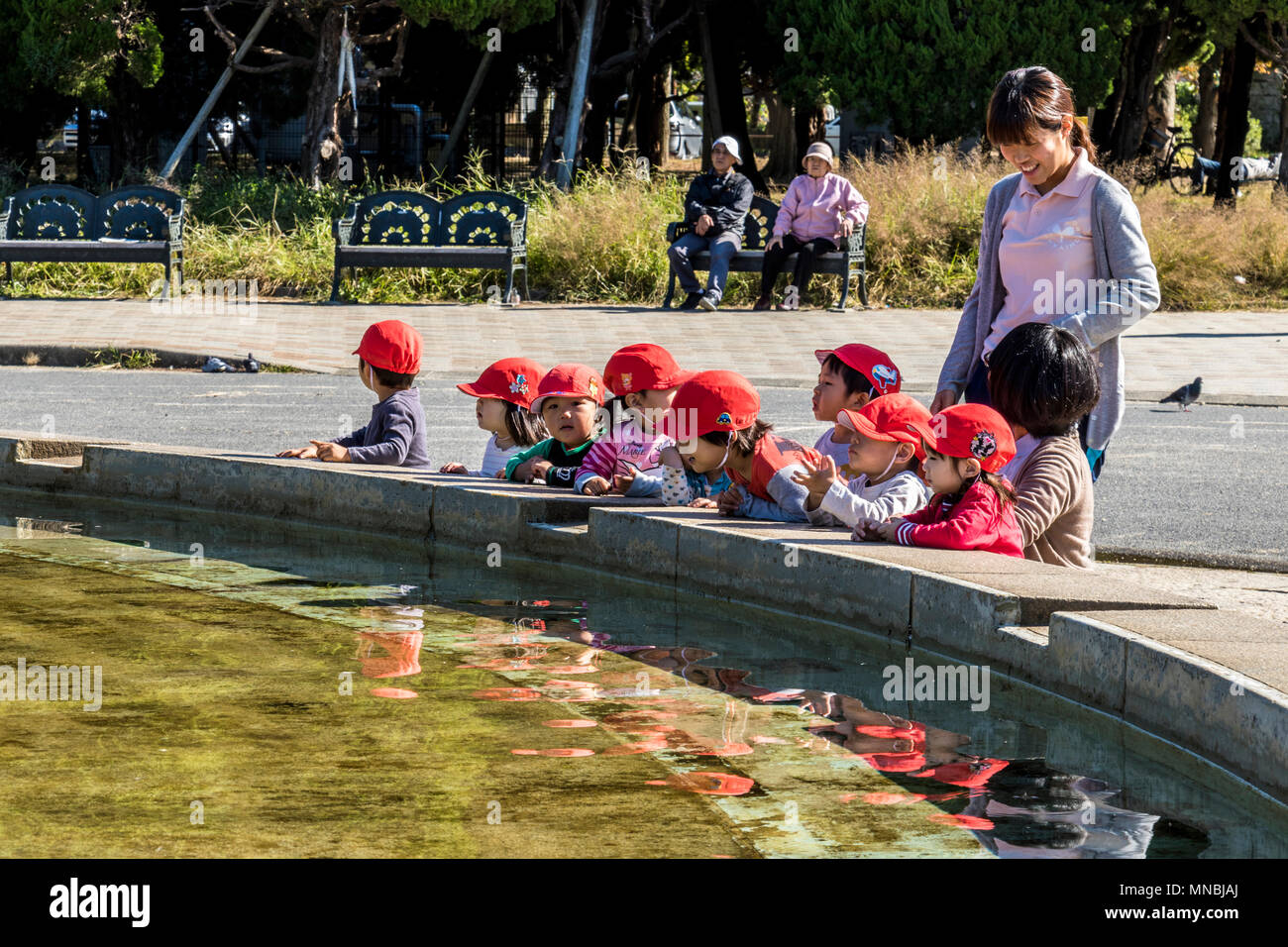 Children in Osaka Castle Park Osaka Japan with lady minder Stock Photo ...