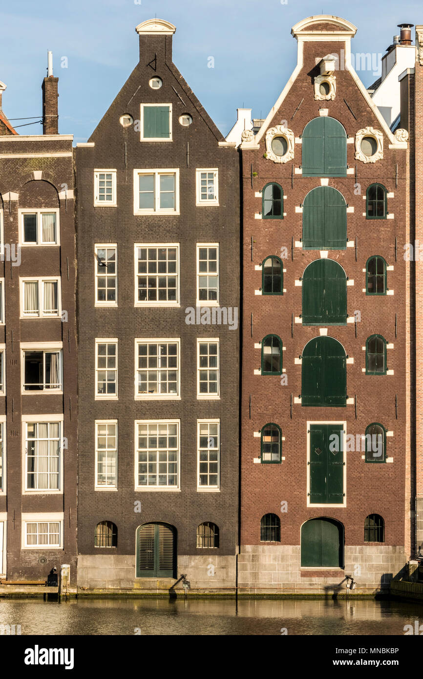 Traditional dutch buildings on a canal in Amsterdam Holland Stock Photo ...