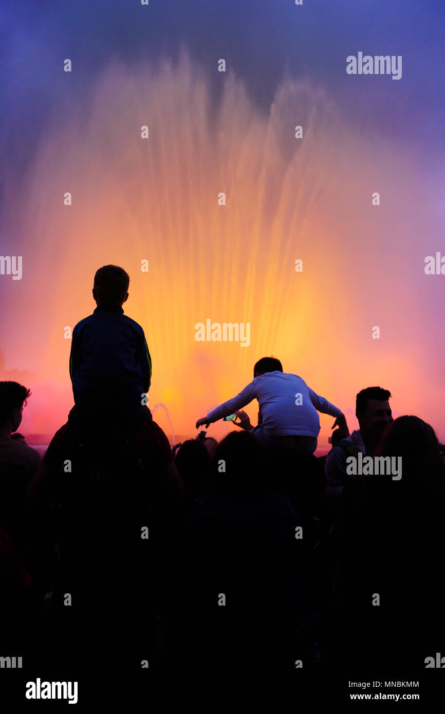 Kids and families watching the magic watching fountain show Stock Photo ...