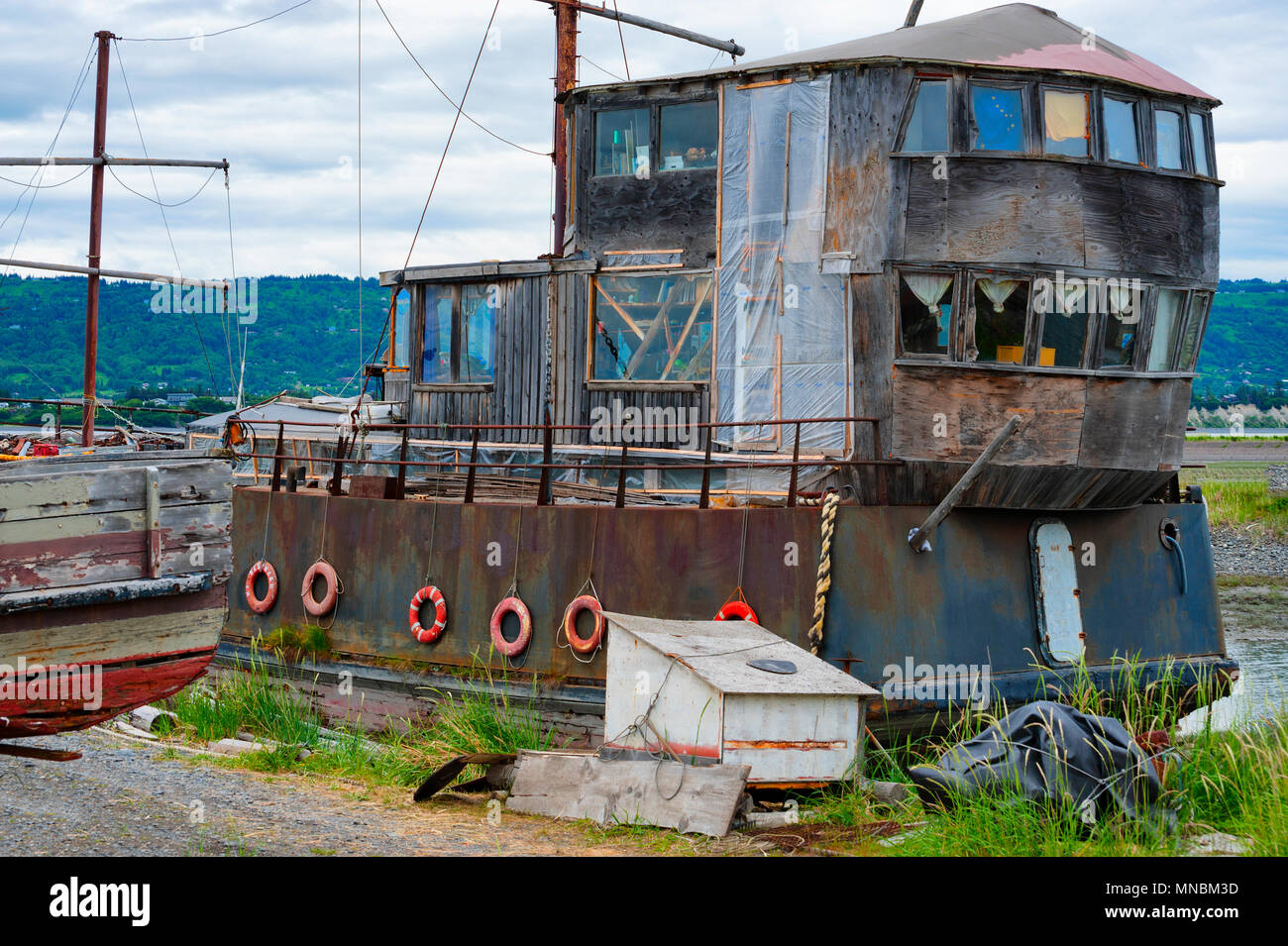 Homer, Alaska, USA - June 28 2017:A boat, surround by other rotting ...