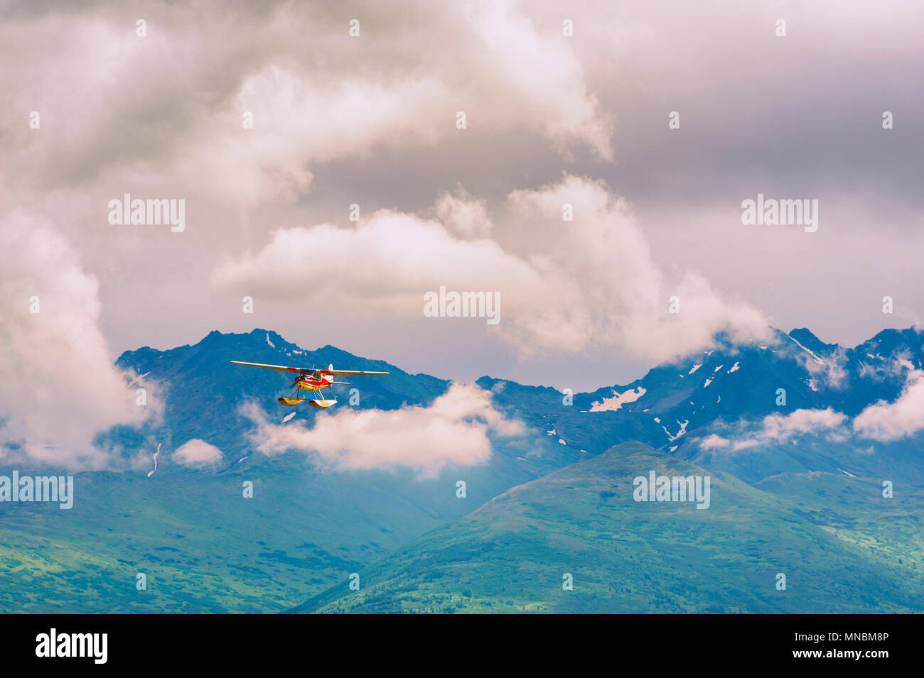 Seaplane flies through clouds hi-res stock photography and images - Alamy