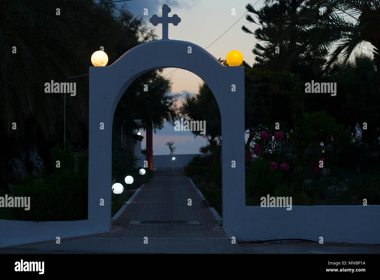 Entrance and fence around church in Malia Stock Photo - Alamy