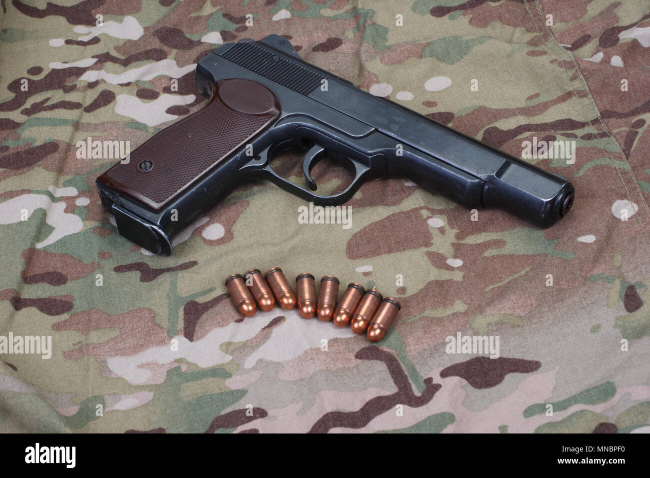 Stechkin automatic pistol APS on camouflage background Stock Photo - Alamy