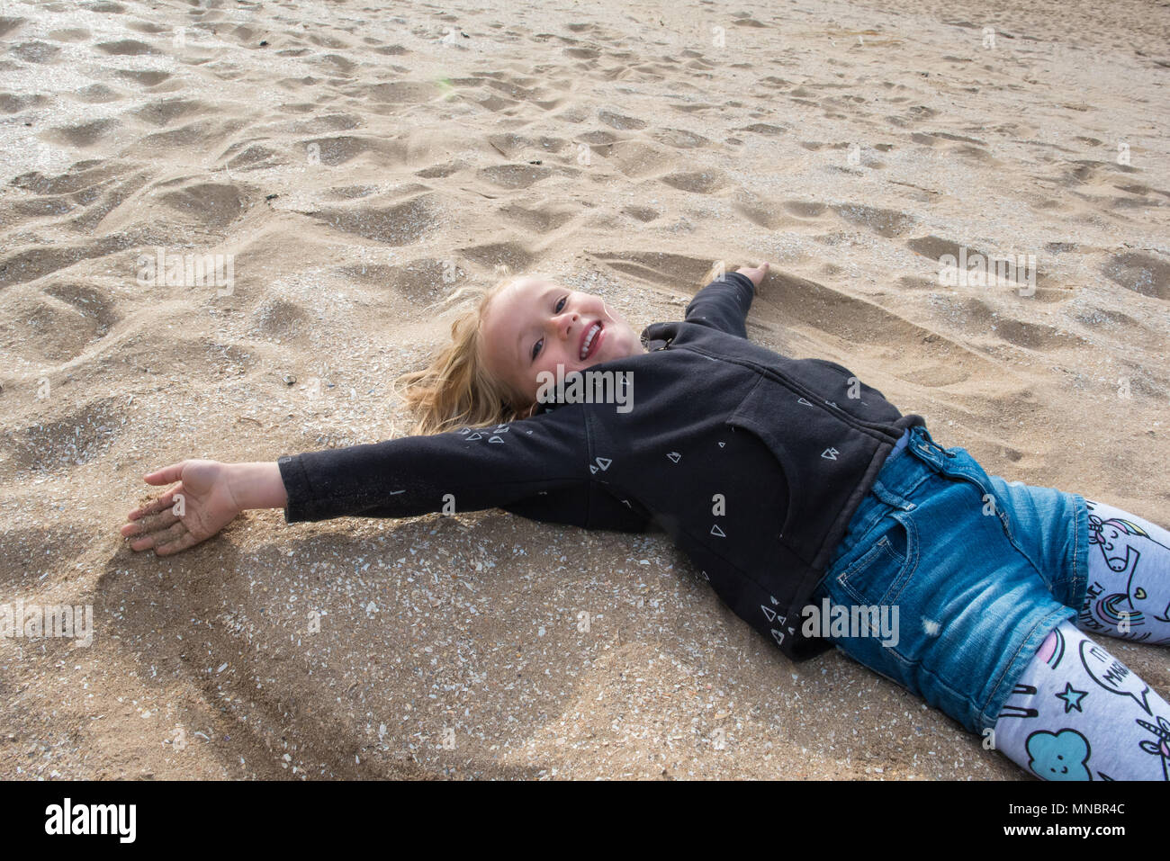 Beach laughing hi-res stock photography and images - Alamy