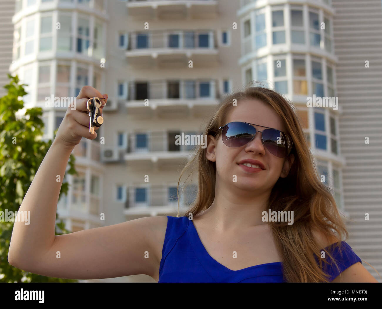 Happy girl keys hi-res stock photography and images - Alamy