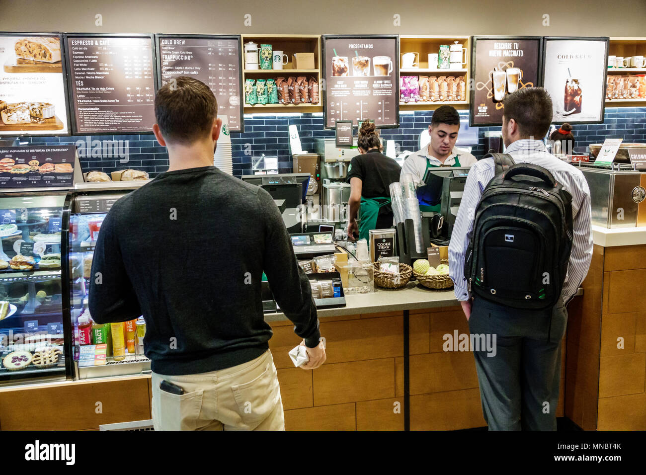 Queue line people starbucks cafe hi-res stock photography and images ...