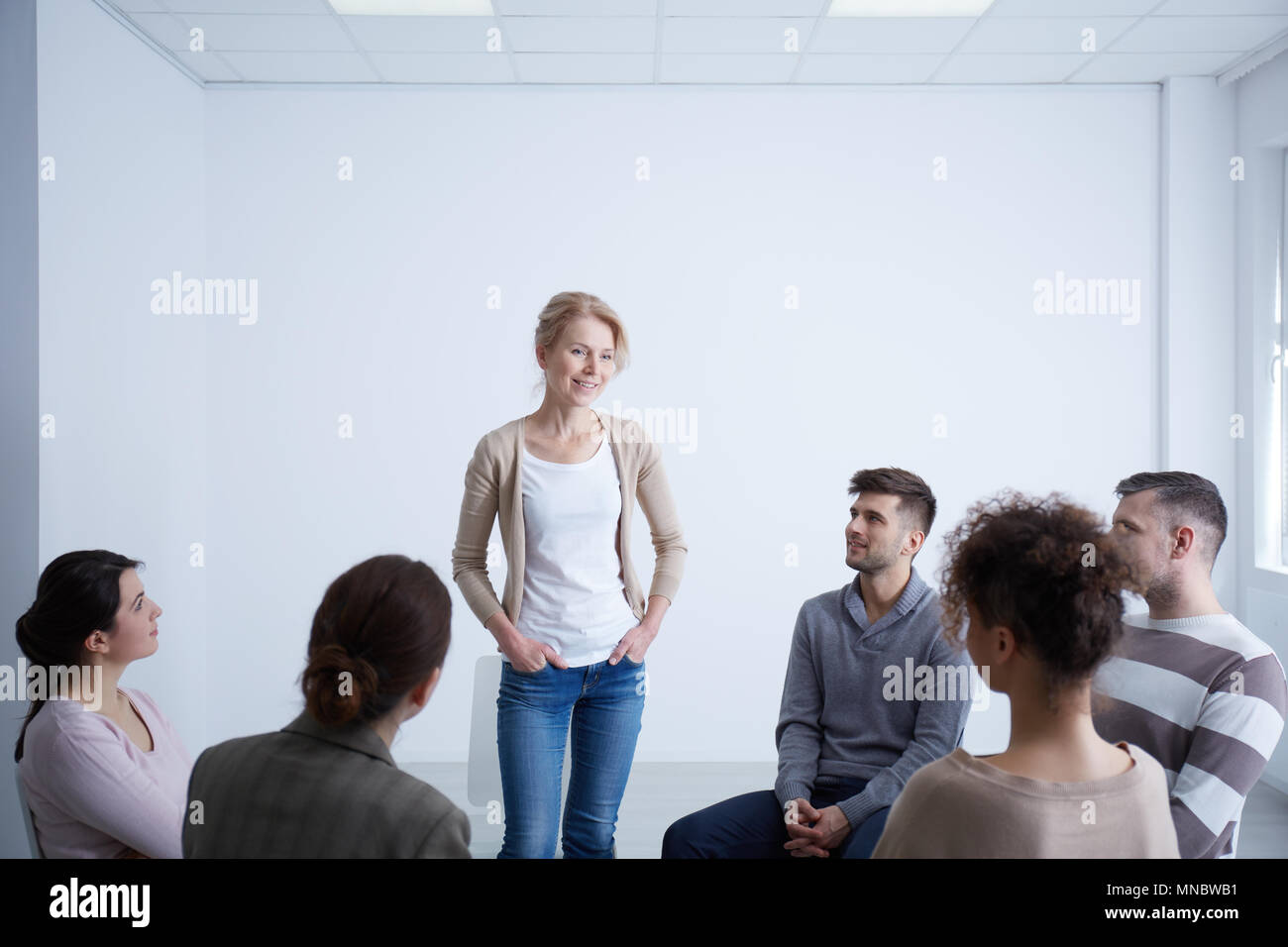 Woman talking about her life during group therapy Stock Photo - Alamy