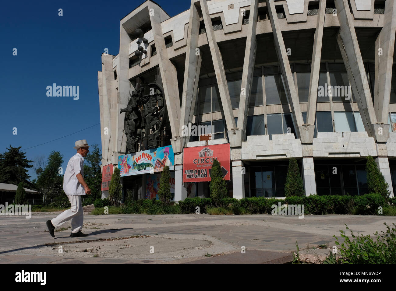 A pedestrian walks past the Communist-era circus building built in 1981 ...