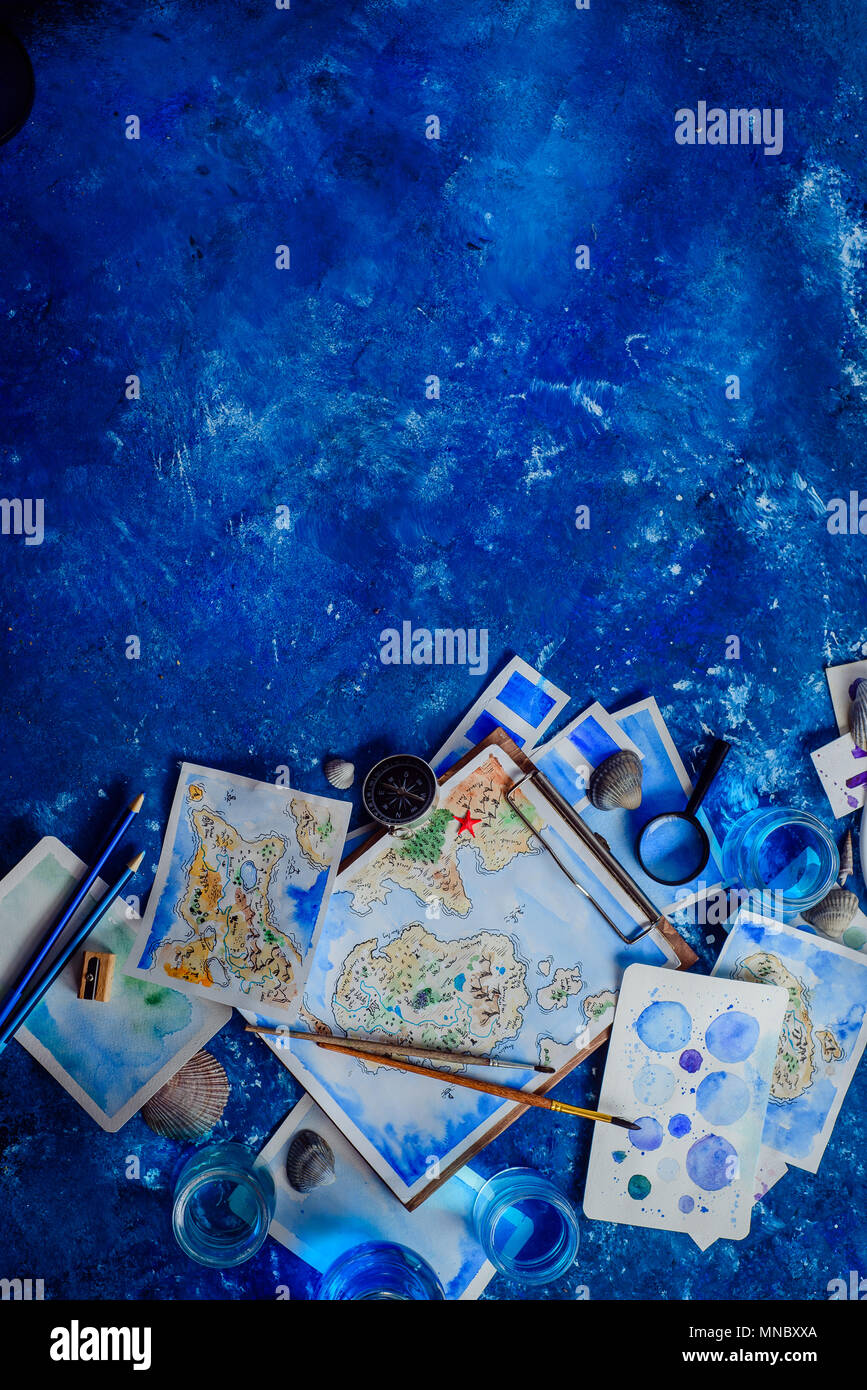 Handpainted fantasy map on a navy blue background with copy space ...