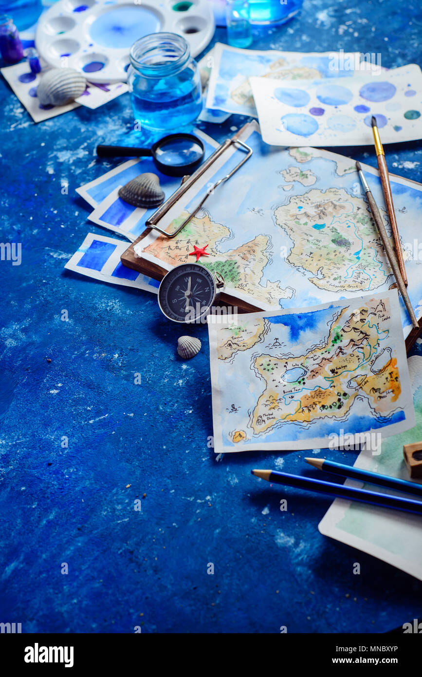 Handpainted fantasy map on a navy blue background with copy space ...