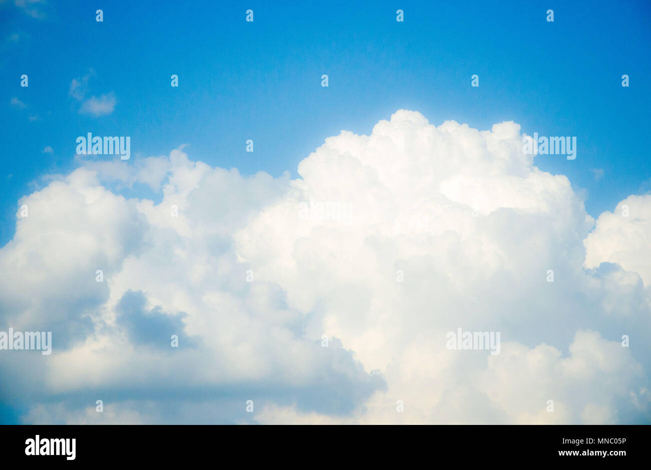 Beautiful blue sky with cloud on the down side of the frame background ...