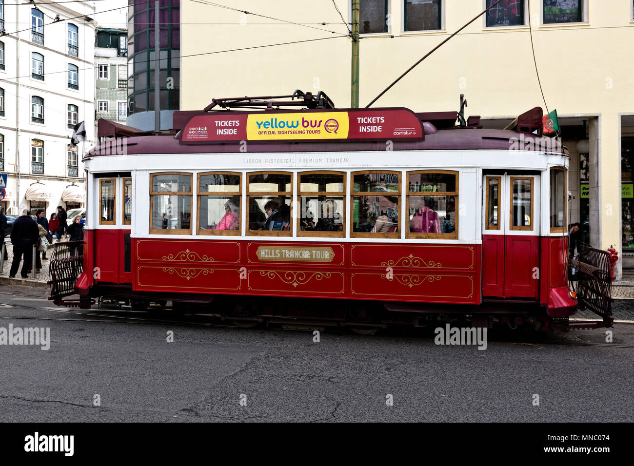 A burgundy Hills Tramcar Tour tram, run by the Yellow Bus Tours filling ...