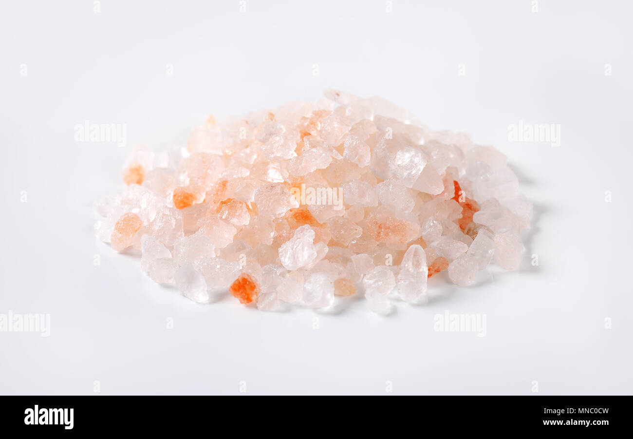 pile of coarse grained salt on white background Stock Photo - Alamy