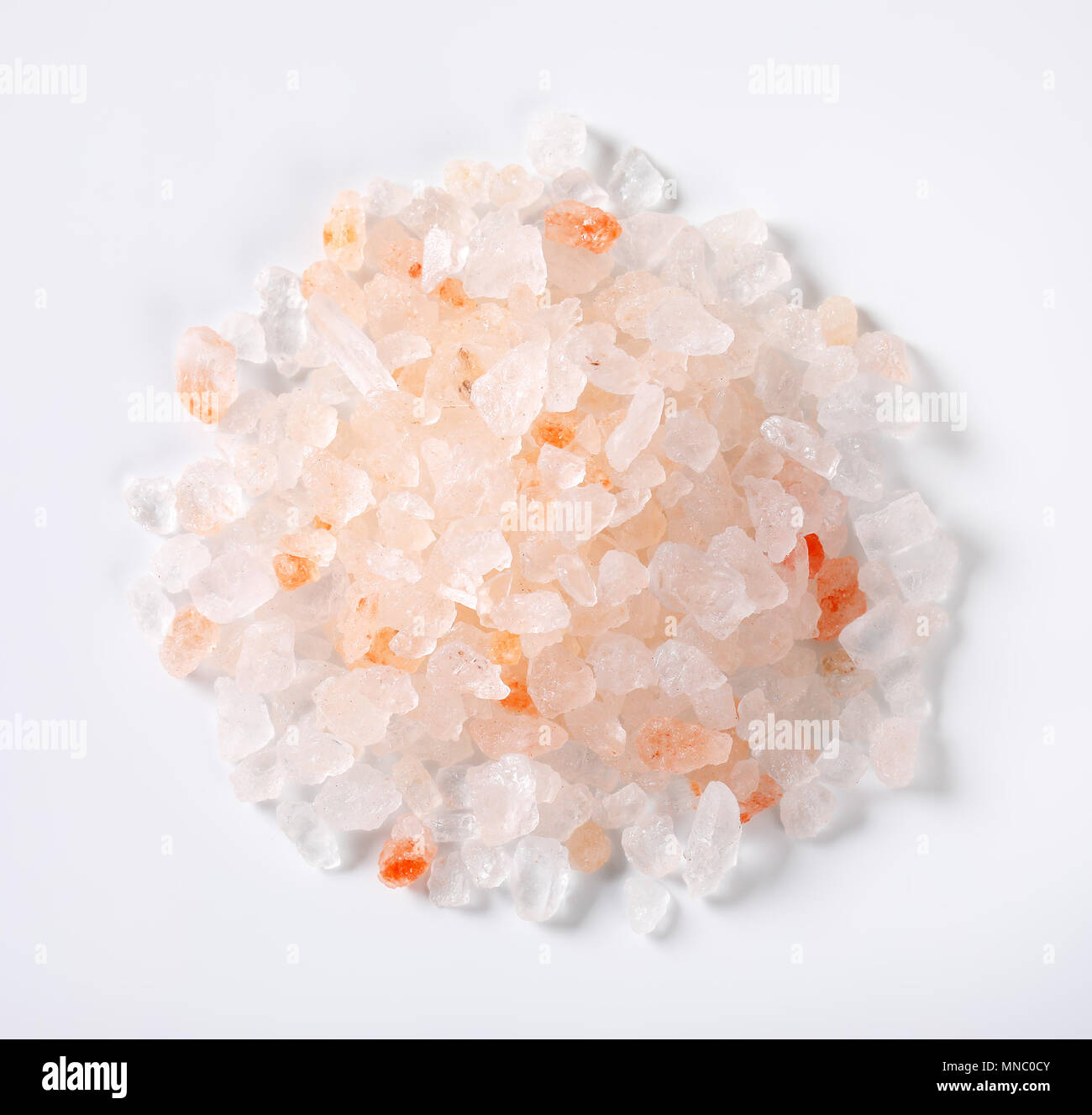 pile of coarse grained salt on white background Stock Photo - Alamy