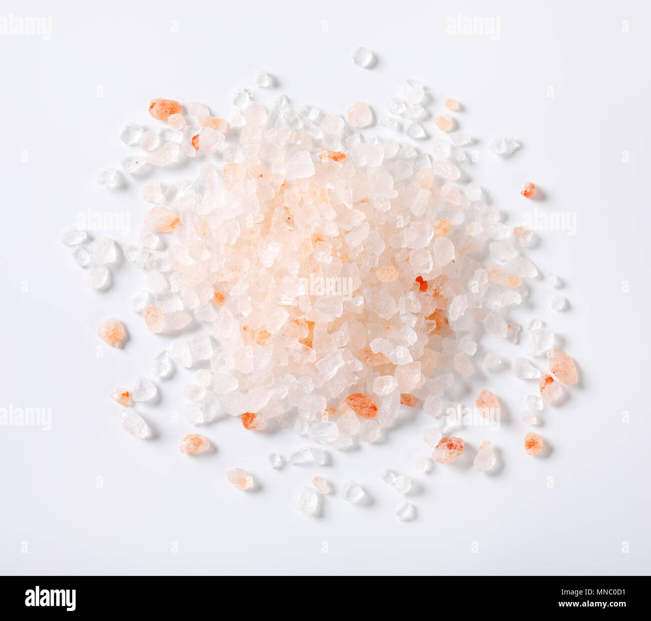 pile of coarse grained salt on white background Stock Photo - Alamy