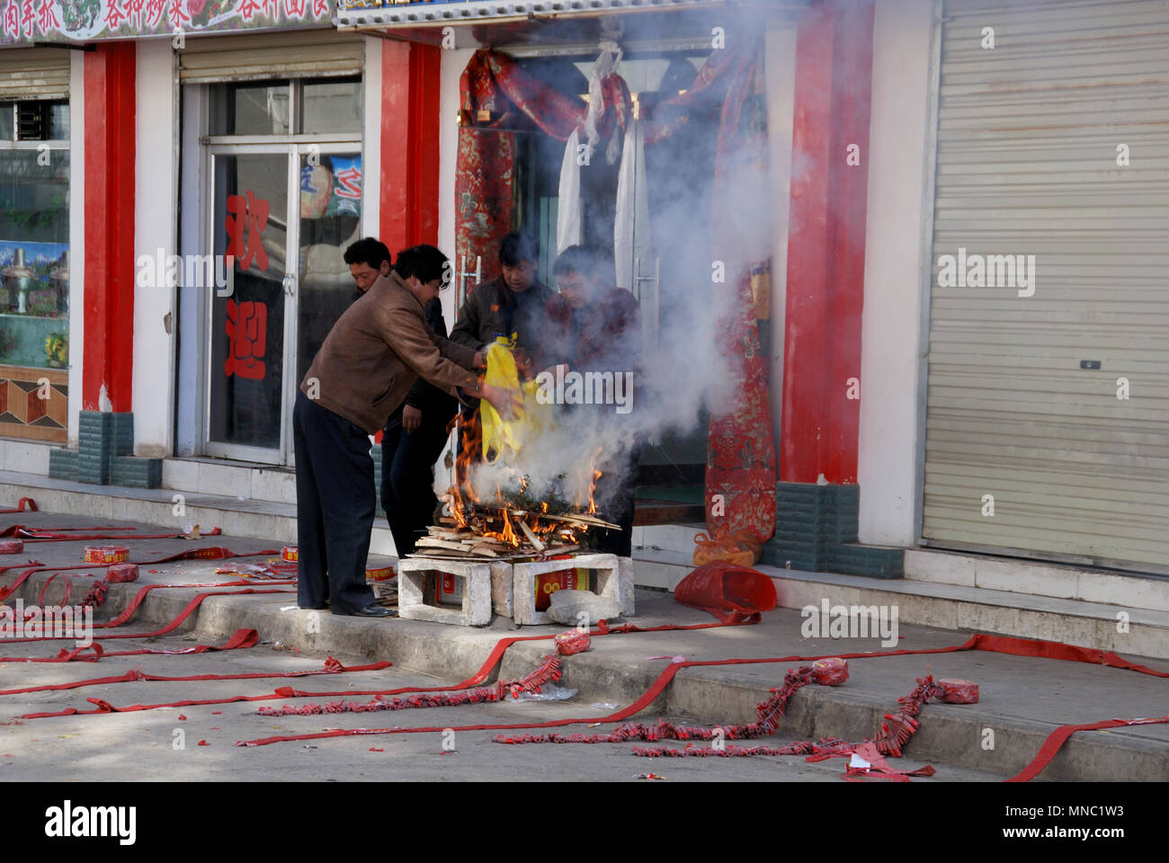 A small explosive charge and a fuse in a heavy paper casing, exploded ...