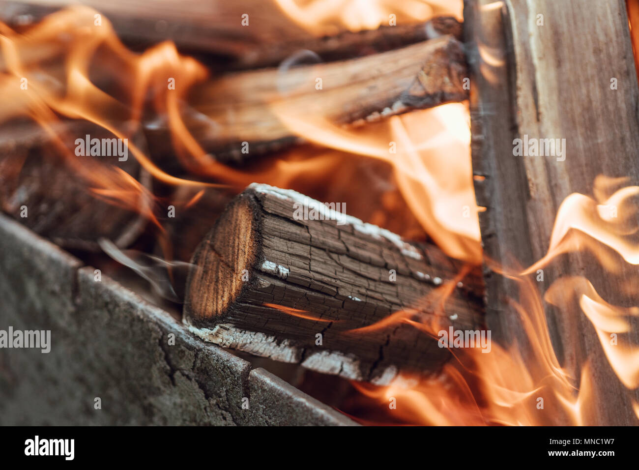flame on burning wood in fireplace Stock Photo - Alamy