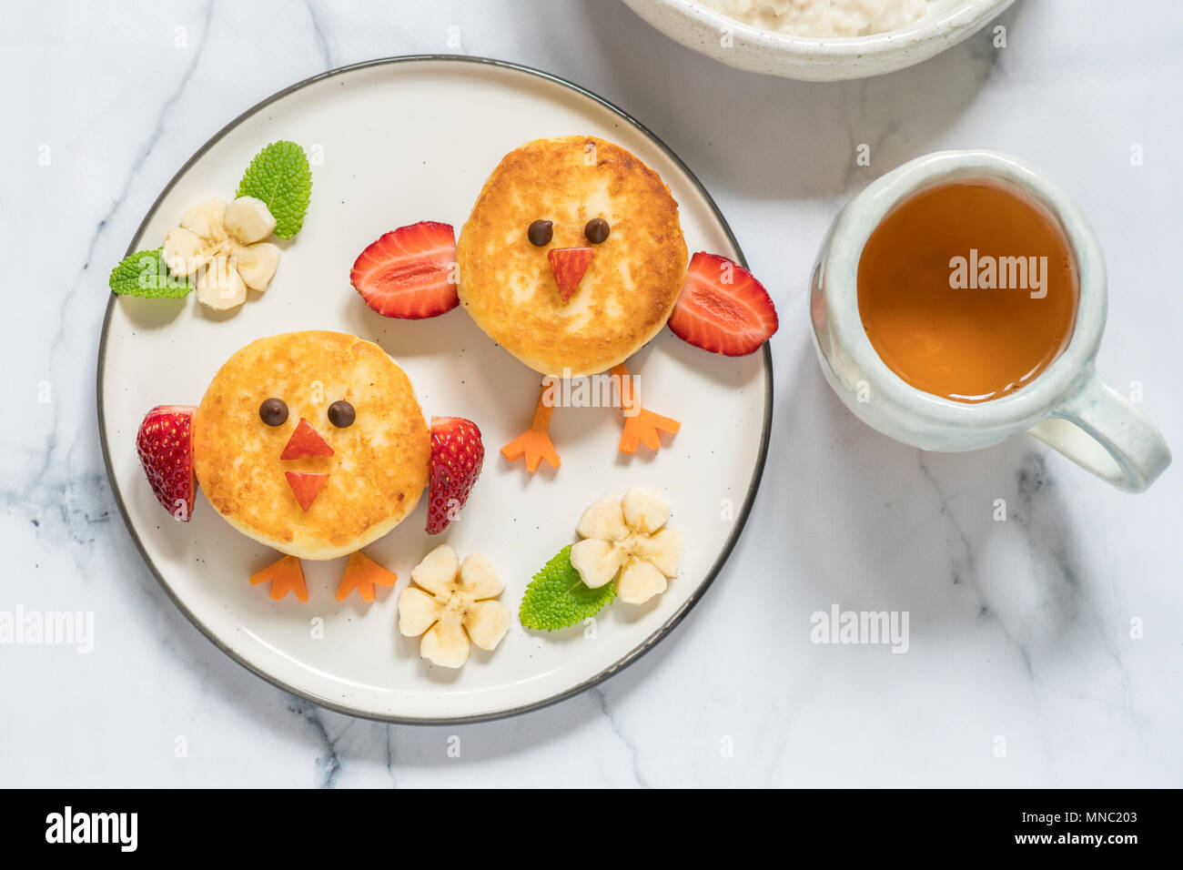 Birds ricotta pancakes for kids breakfast Stock Photo - Alamy